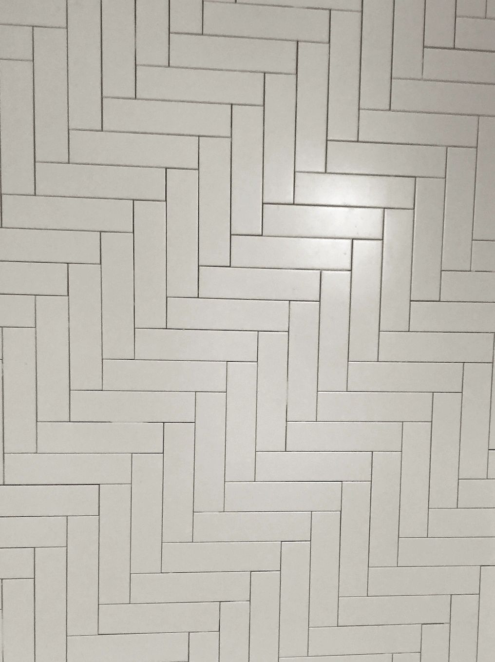 4" x 12" Ceramic Subway Tile laid in herringbone pattern